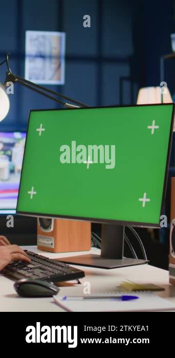 Vertical video Arabic man looking at chroma key computer screen while ...