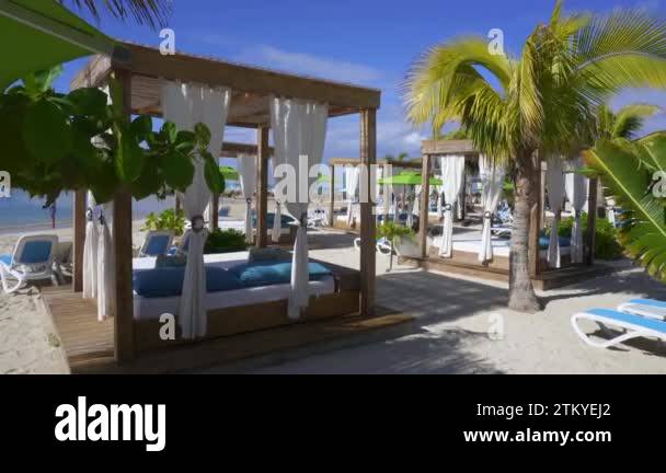 Beach cabanas overlooking the Caribbean Sea. Relax in the shade. Beach ...