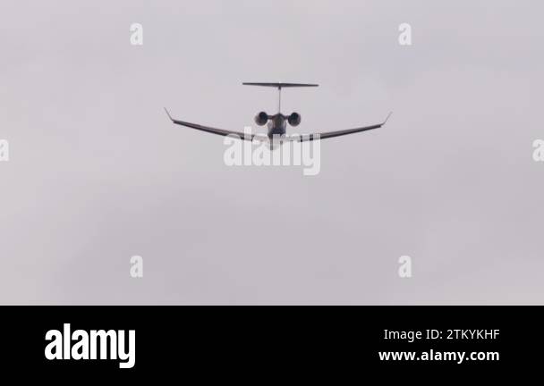 A small jet passenger plane with an unrecognizable livery is flying ...