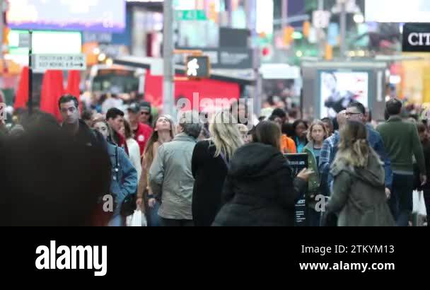 Anonymous Urban Crowd of commuters, unrecognizable tourists walking in ...