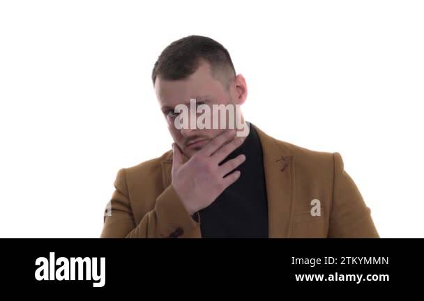 Thoughtful young businessman touching his chin. Emotions, feelings ...