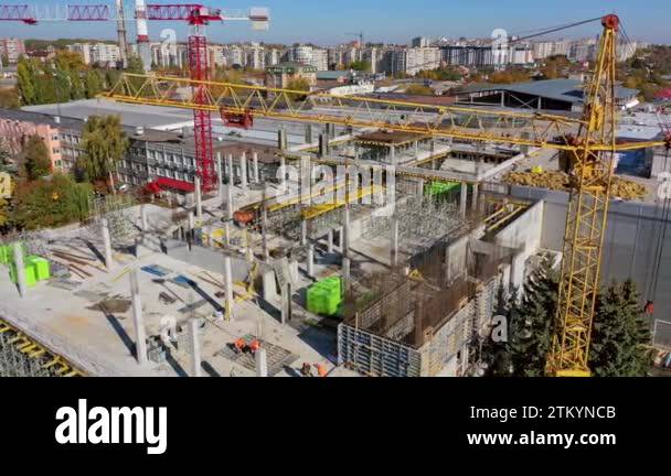 Cranes and building construction site. Aerial view of tower cranes ...