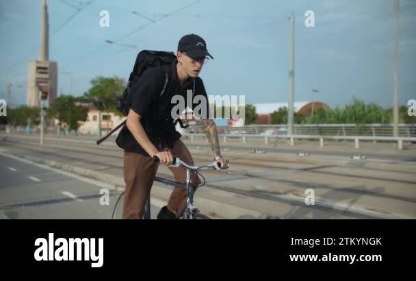 Man cycles along street Stock Videos & Footage - HD and 4K Video Clips ...