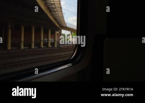 View on railroad track from the window of fast train. 4K Interior view ...
