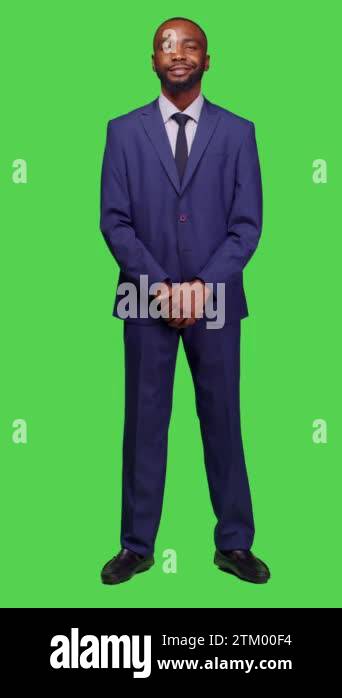 Vertical video: Front view of smiling corporate employee with office ...