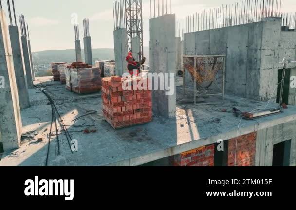 Construction of a brick house. The builder dismantles the Telescopic ...