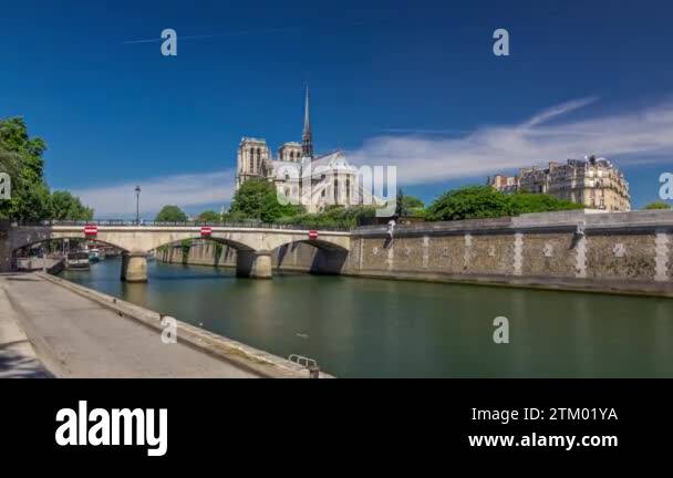 Seine waterfront and Notre Dame de Paris timelapse hyperlapse is the ...