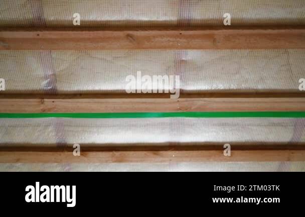 The ceiling of a private house is insulated and prepared for cladding ...