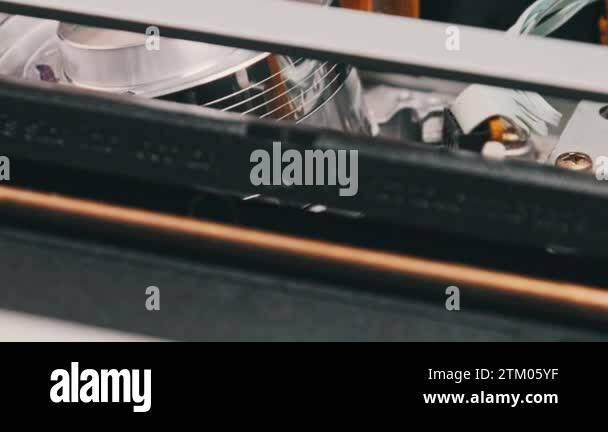 VHS video tape putting inside a VCR recorder and plays. Vintage VHS ...