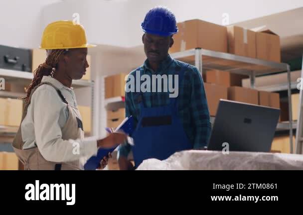 Female supervisor doing quality control in storehouse, working with ...