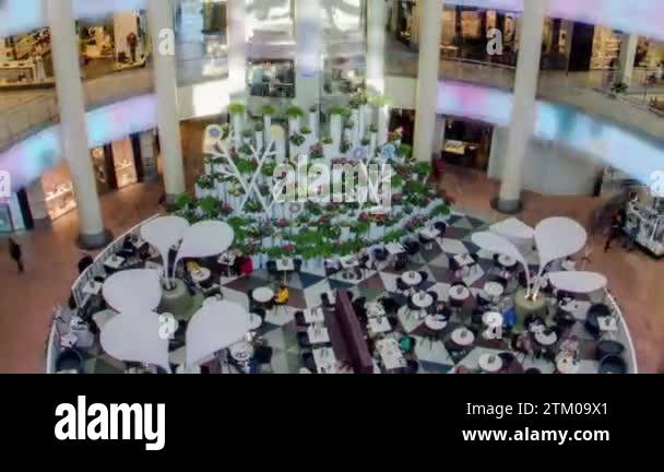 Many shops in multi-level department store or shoping mall timelapse ...