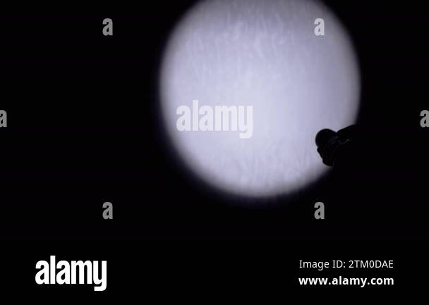 Person Shines a Flickering Flashlight on Wall in a Dark Room ...