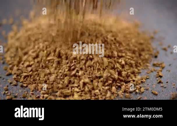 Falling Particles of Instant Coffee Granules Fly into a Pile on a Black ...