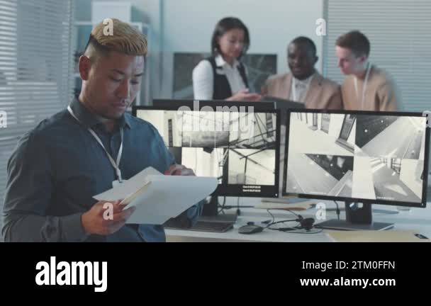 Waist up slowmo of professional Asian male security agency supervisor ...