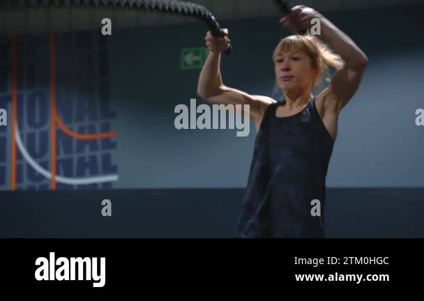 Girl athlete performs complex exercises to maintain her health and body ...