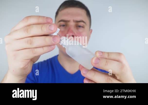 Azelaic acid. Man applies azelainates to her face. Laboratory research ...