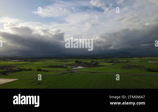 Clouds hung in the interim over the green fields. They portend a ...
