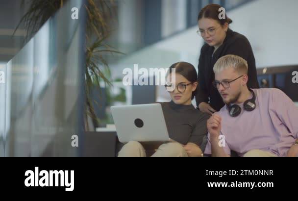 A diverse group of colleagues exchange business experiences, engage in ...