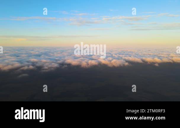 View from high altitude of bright colorful sunset sky with vivid smooth ...