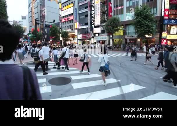 people cross the Shibuya intersection in Tokyo Stock Video Footage - Alamy