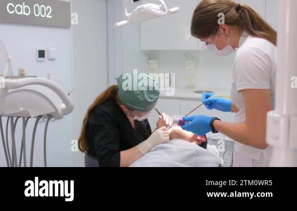 surgical operation in dentistry wisdom tooth extraction dentist and ...