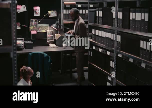 African american law agents reading private records and doing ...