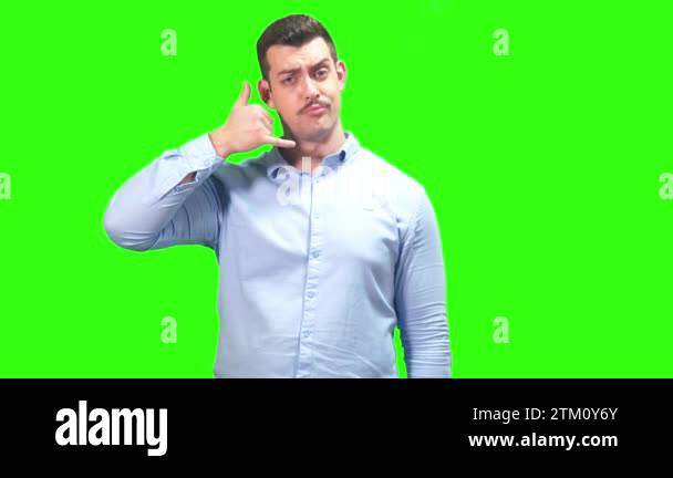 cheerful man with a mustache in a blue shirt tells and points up on a ...