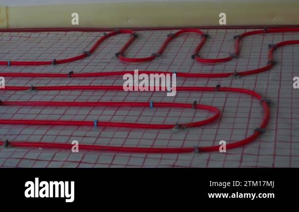 Underfloor heating in construction of new residential house. Pipefitter ...