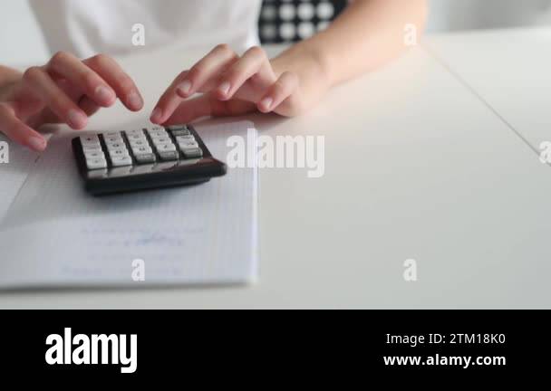 Child hands with calculator counting during school homework. Kid ...