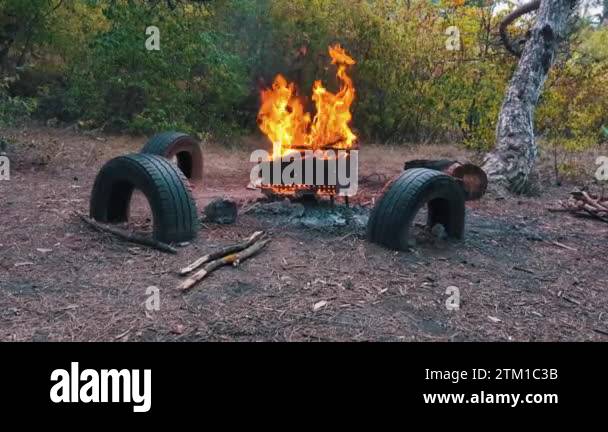 A Sunset Bonfire Illuminates the Scene as Friends Share Stories and ...