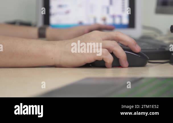 man using mouse and typing on a keyboard close up - static - rack focus ...