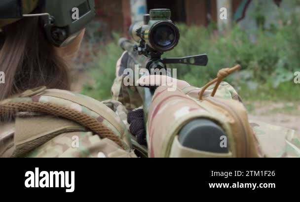 woman is holding sniper gun,Aiming On Target By Looking On ...