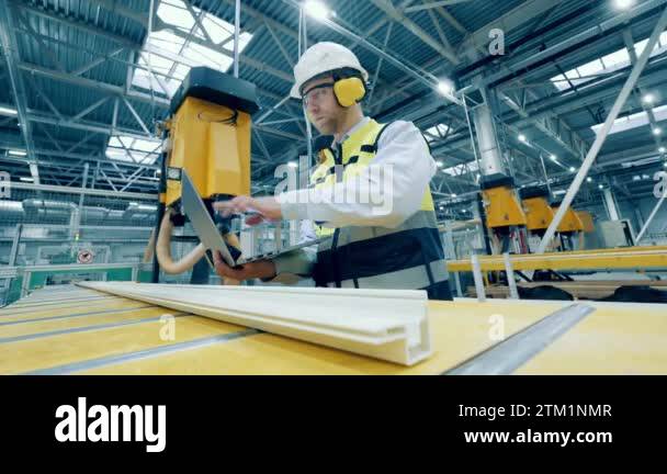 Industrial worker is assessing a fiberglass bar. 4K Stock Video Footage ...