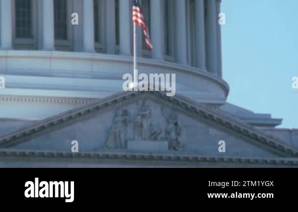United States Flag Waving Close Up on top of The Genius of America ...
