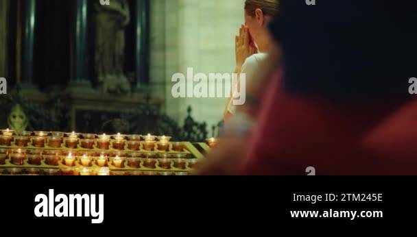 Young woman praying in church. Religious adult girl in prayer to God ...