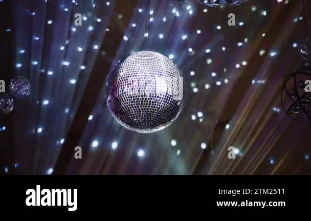 Night club ceiling with mirror ball and lights. Silver disco ball ...