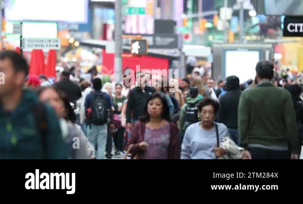 Anonymous Urban Crowd of commuters, unrecognizable tourists walking in ...
