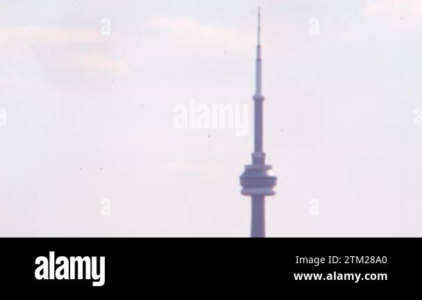 CN Tower Sky High Tip Against Blue Sky Background. Iconic CN Tower in ...