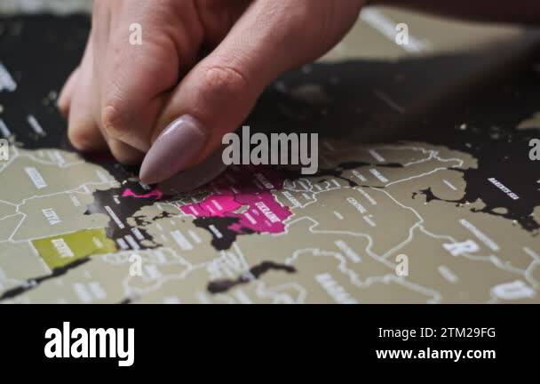 Female Hand Scratching Europe countries on the Surface of Scratch World ...