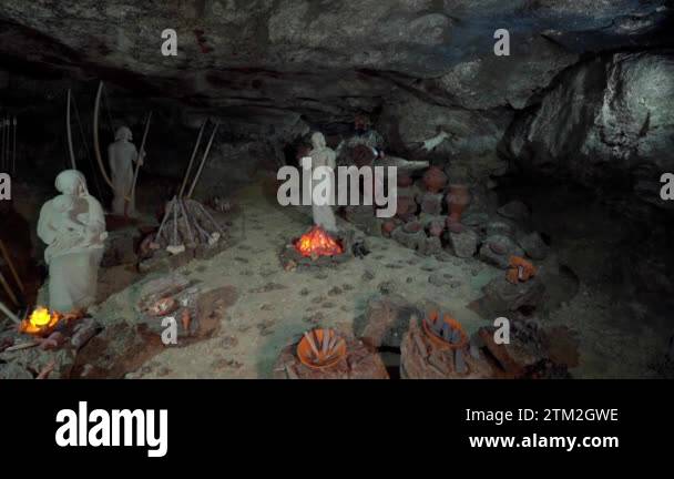 Ancient sculptures in an underground cave. Archaeological excavations ...