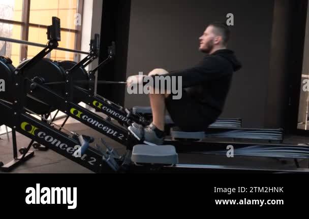 February 21, 2023 Ukraine, Dnipro. Rowing machine firm Concept 2.A man ...