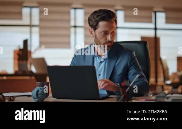 Businessman making work notes on papers at office desk closeup ...