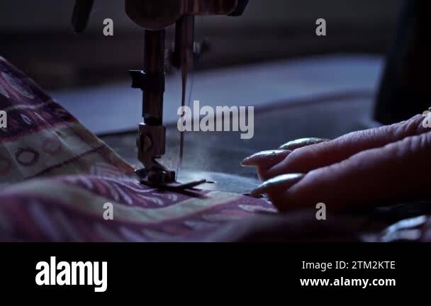 Vintage sewing machine needle in motion. Close-up of a sewing machine ...