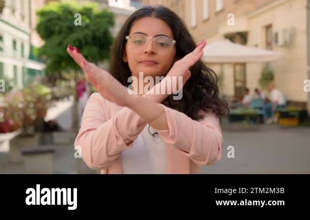 Female portrait young Indian Arabian ethnic woman showing prohibition ...