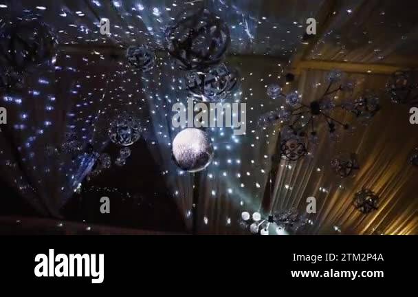 Nightclub ceiling with many shining balls. Disco ball shimmering and ...