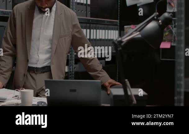 Inspector searching for forensic evidence in case file, analyzing clues ...