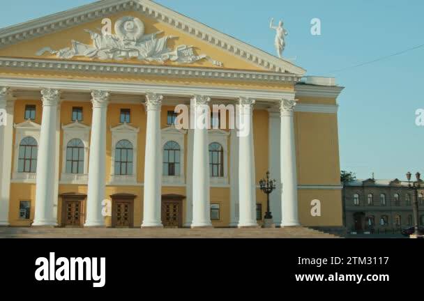 Establishing shot of front exterior of 20th century classic style ...
