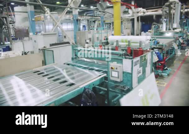 Modern conveyors for monolithic polycarbonate sheets in workshop of ...