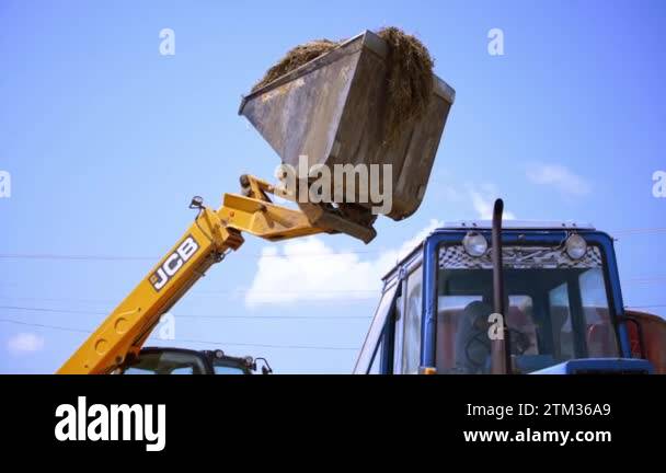 Loading hay on truck Stock Videos & Footage - HD and 4K Video Clips - Alamy