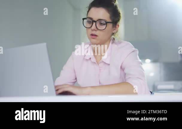 Exhausted young woman student leaning head on hands, resting during ...